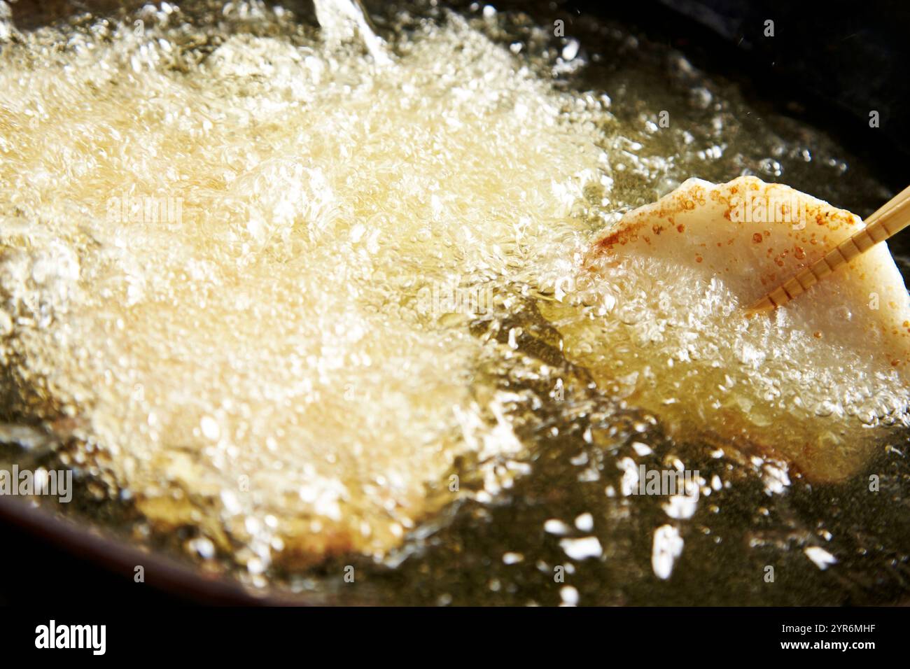 Photo of the process of frying deep-fried fish cakes Stock Photo - Alamy