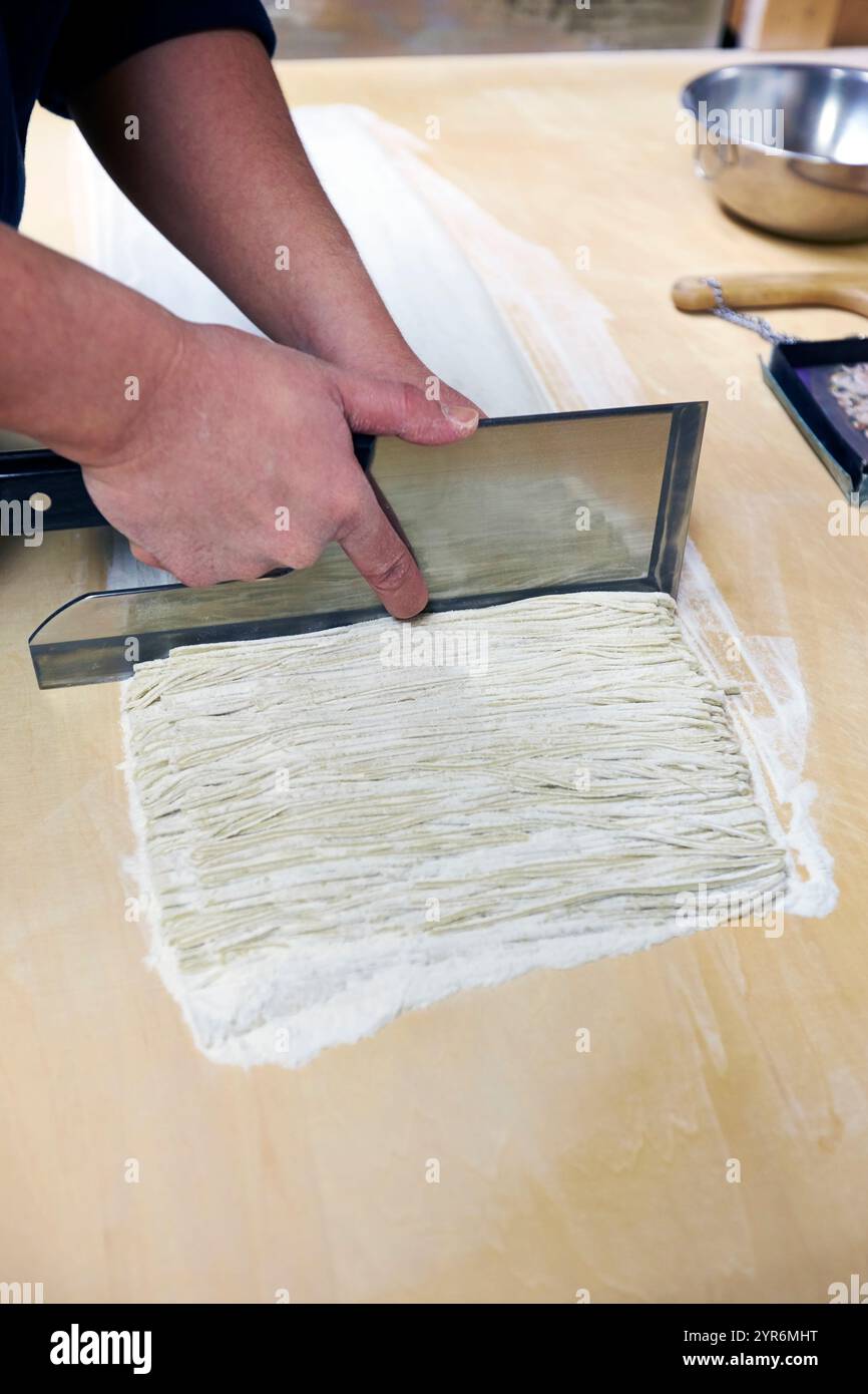 Photograph of cutting handmade buckwheat noodles, Soba Stock Photo - Alamy