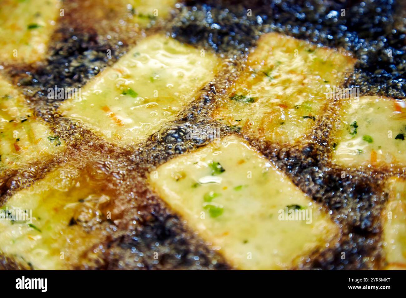 Photograph of deep-fried tofu with vegetables being deep-fried Stock ...