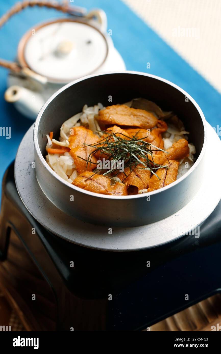 Rice cooked with sea urchin Stock Photo - Alamy