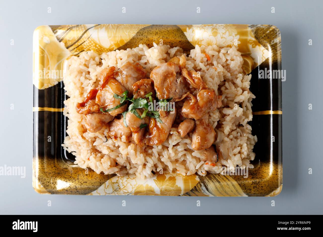 Chicken with Gomoku gohan rice lunch box Stock Photo - Alamy