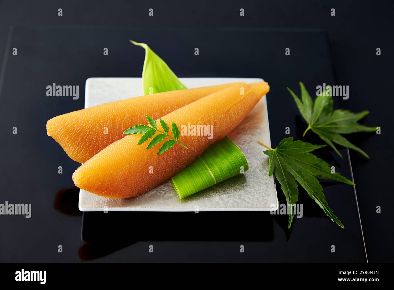 Seasoned herring roe with red leaves Stock Photo - Alamy