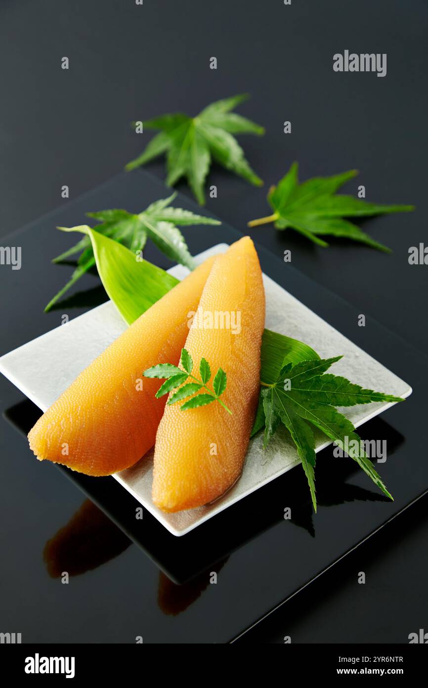 Seasoned herring roe with red leaves Stock Photo - Alamy