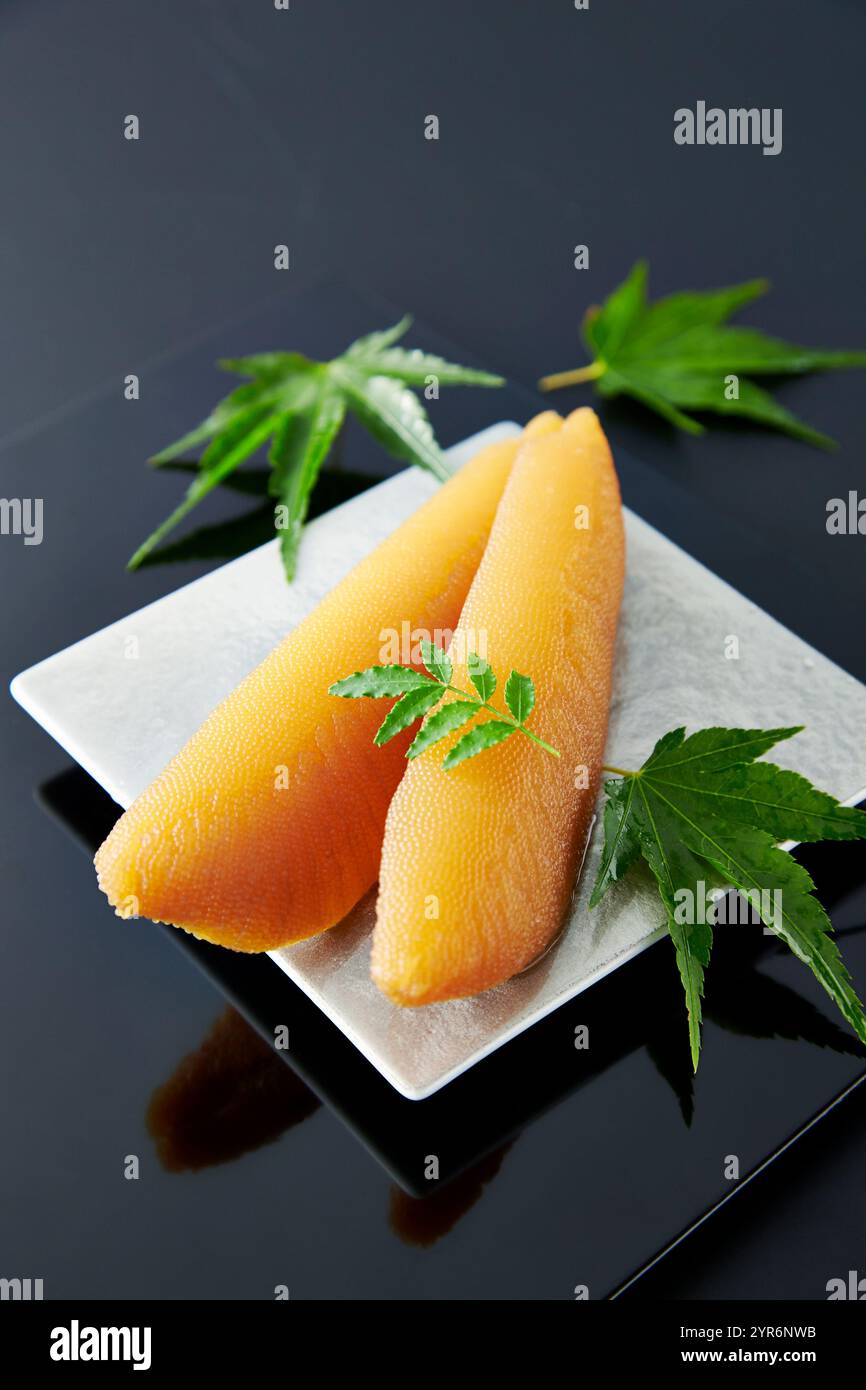 Seasoned herring roe with red leaves Stock Photo - Alamy