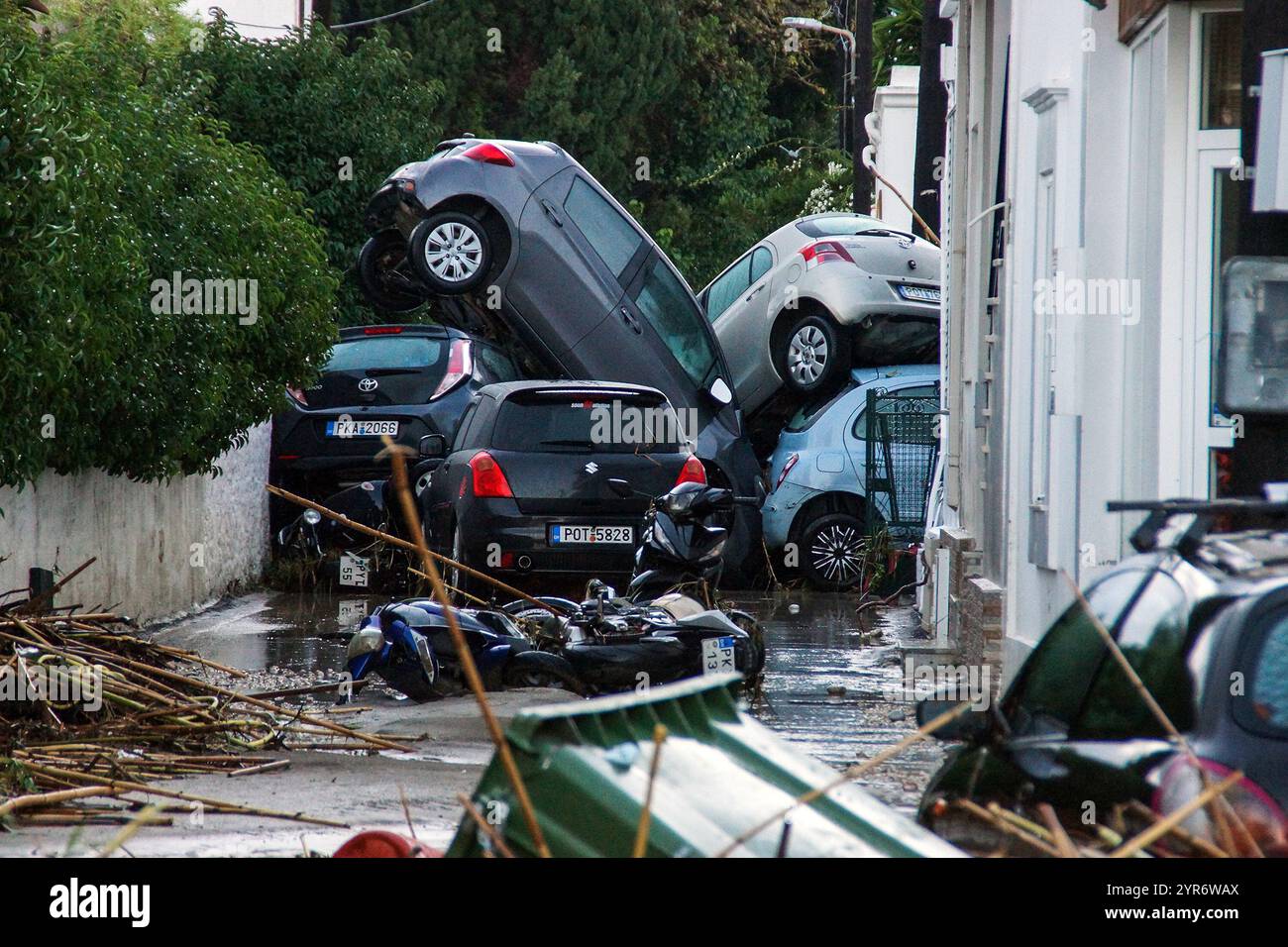 Rhodes Island, Greece. 1st Dec, 2024. Cars damaged by flash flood are seen on a street on Rhodes ...