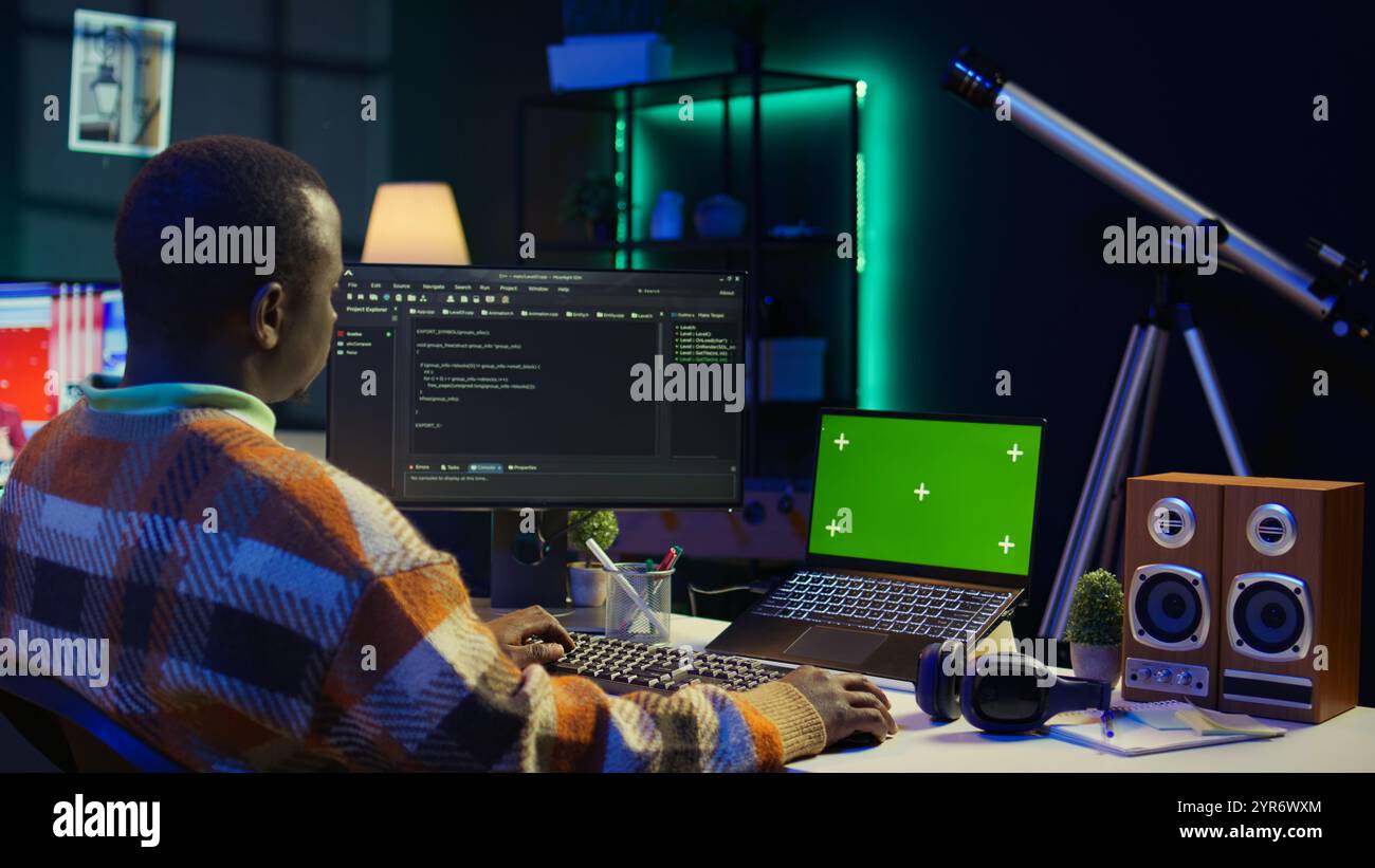 Black web developer handling database servers for safety with green ...