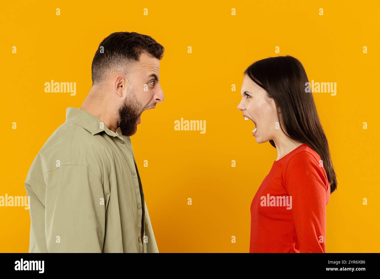 Couple passionately arguing with expressions of anger and frustration ...