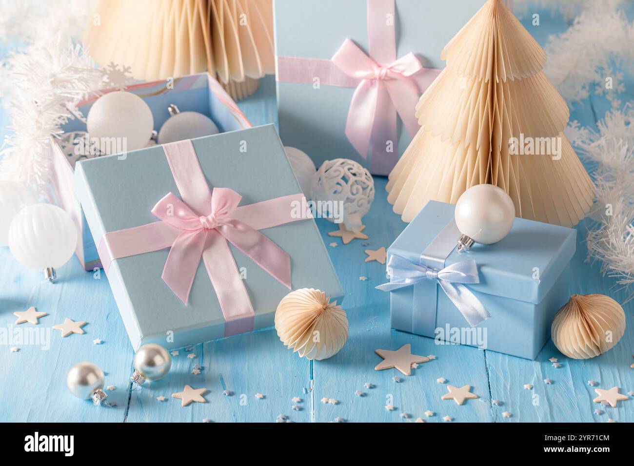 Beautiful blue Christmas gift box with decorations and baubles ...