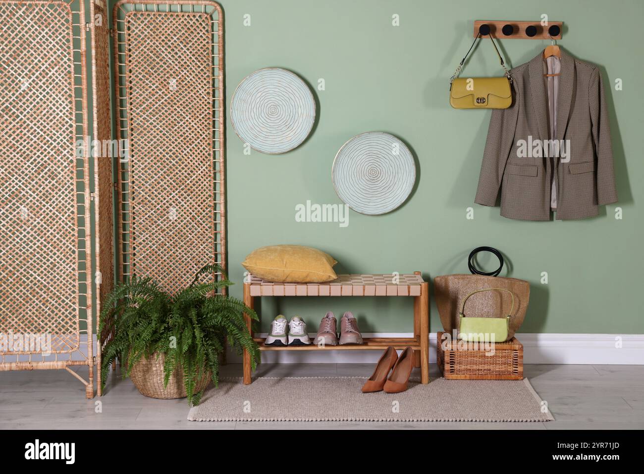 Stylish hallway interior with bench and folding screen Stock Photo - Alamy