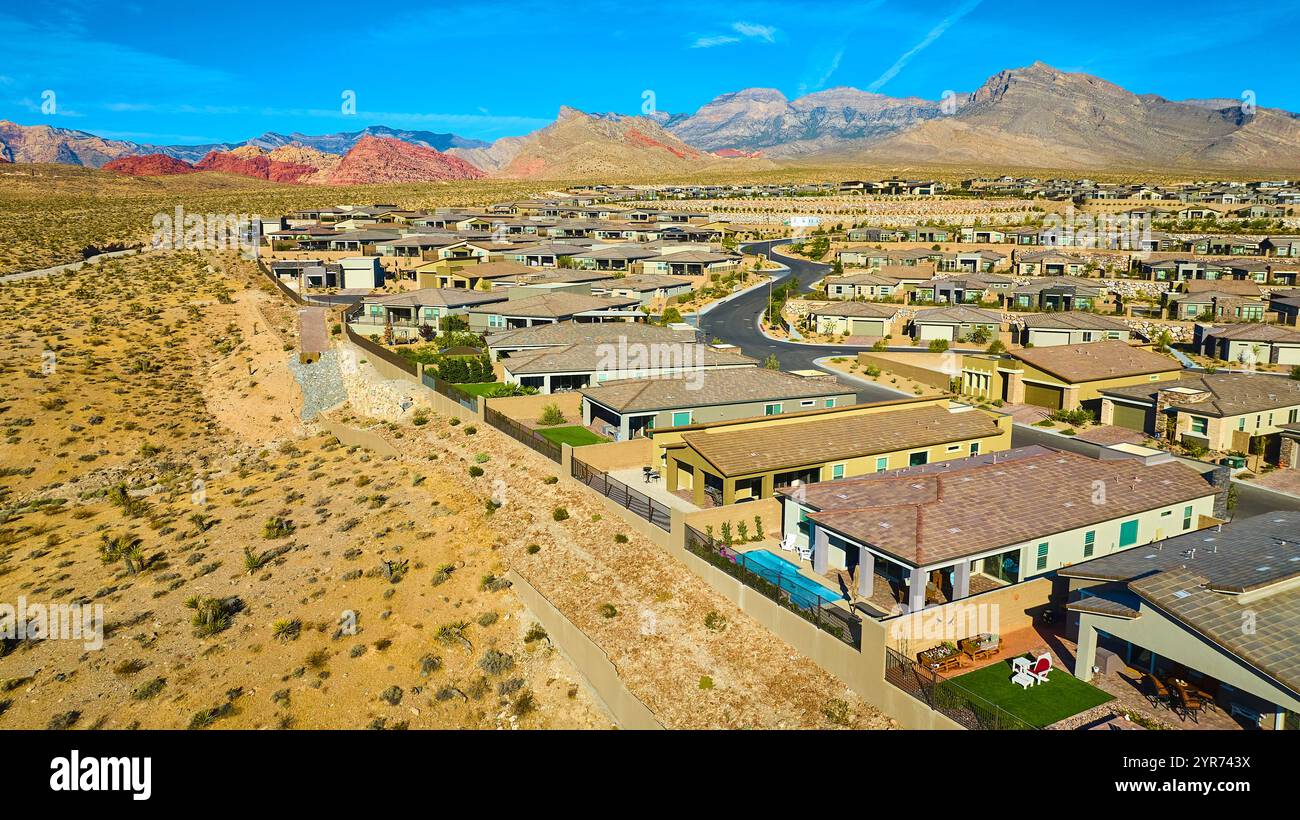 Aerial of Suburban Homes Against Red Rock Canyon Desert Backdrop Stock ...