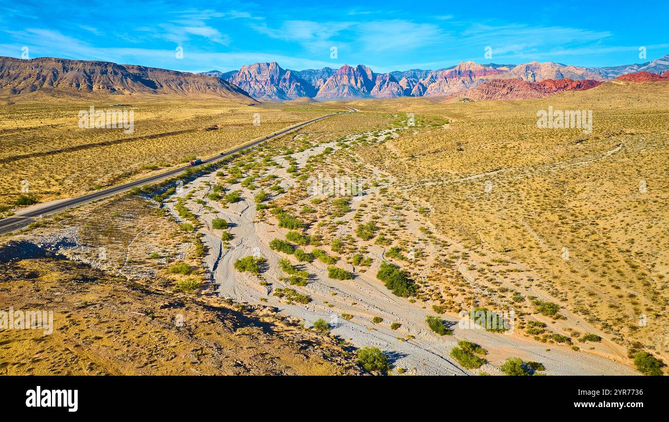 Aerial of Nevada Desert with Red Rock Formations and Roadway Stock ...