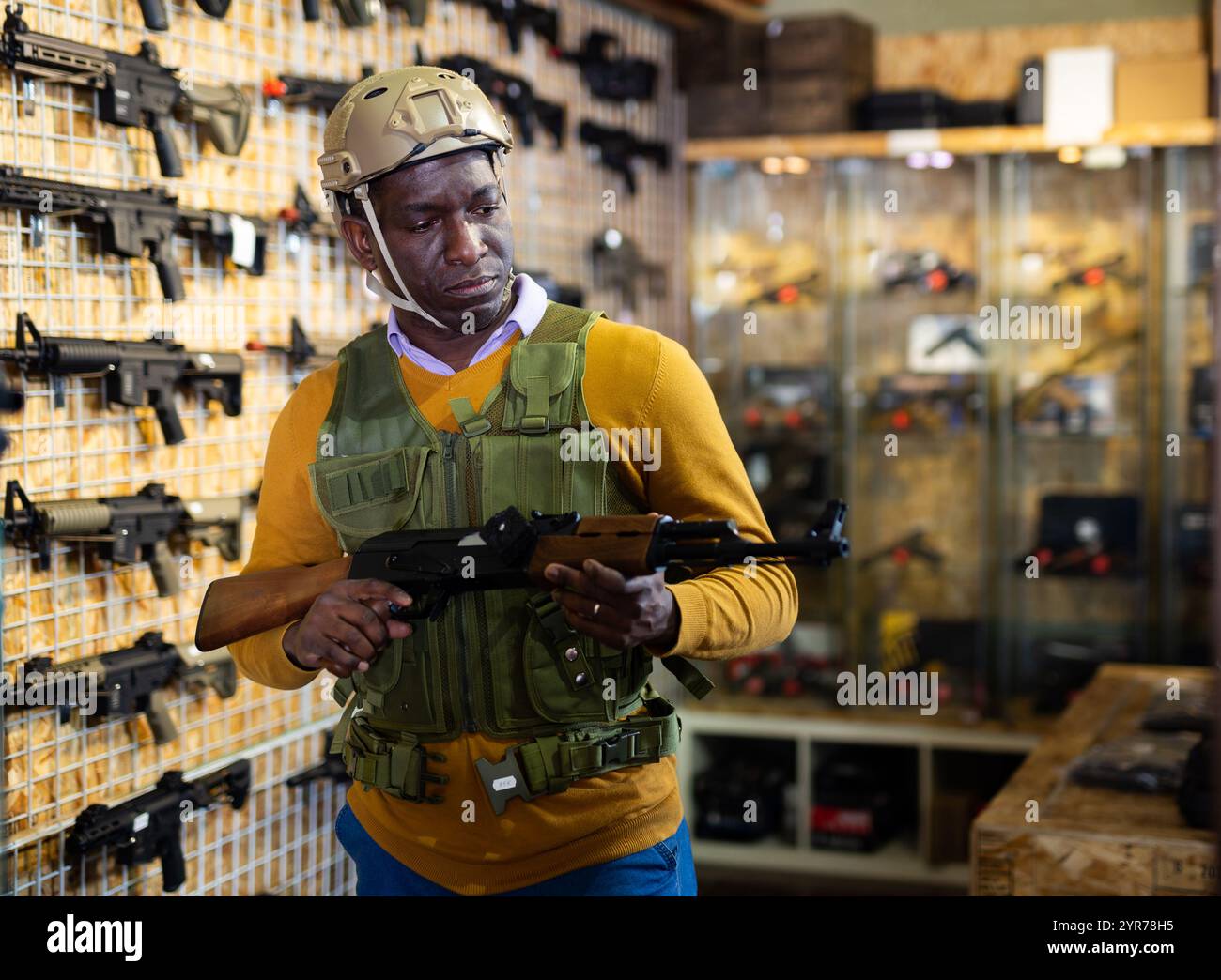 African american man in army uniform with weapon in military shop Stock ...