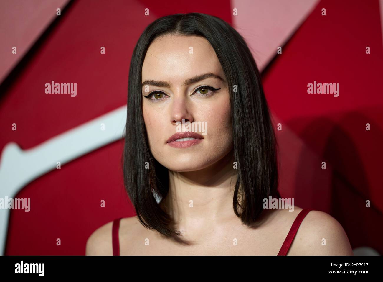 Daisy Ridley poses for photographers upon arrival at the The Fashion ...