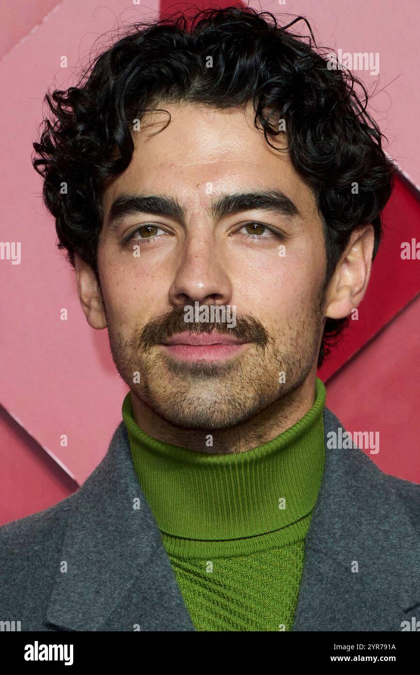 Joe Jonas poses for photographers upon arrival at the The Fashion ...