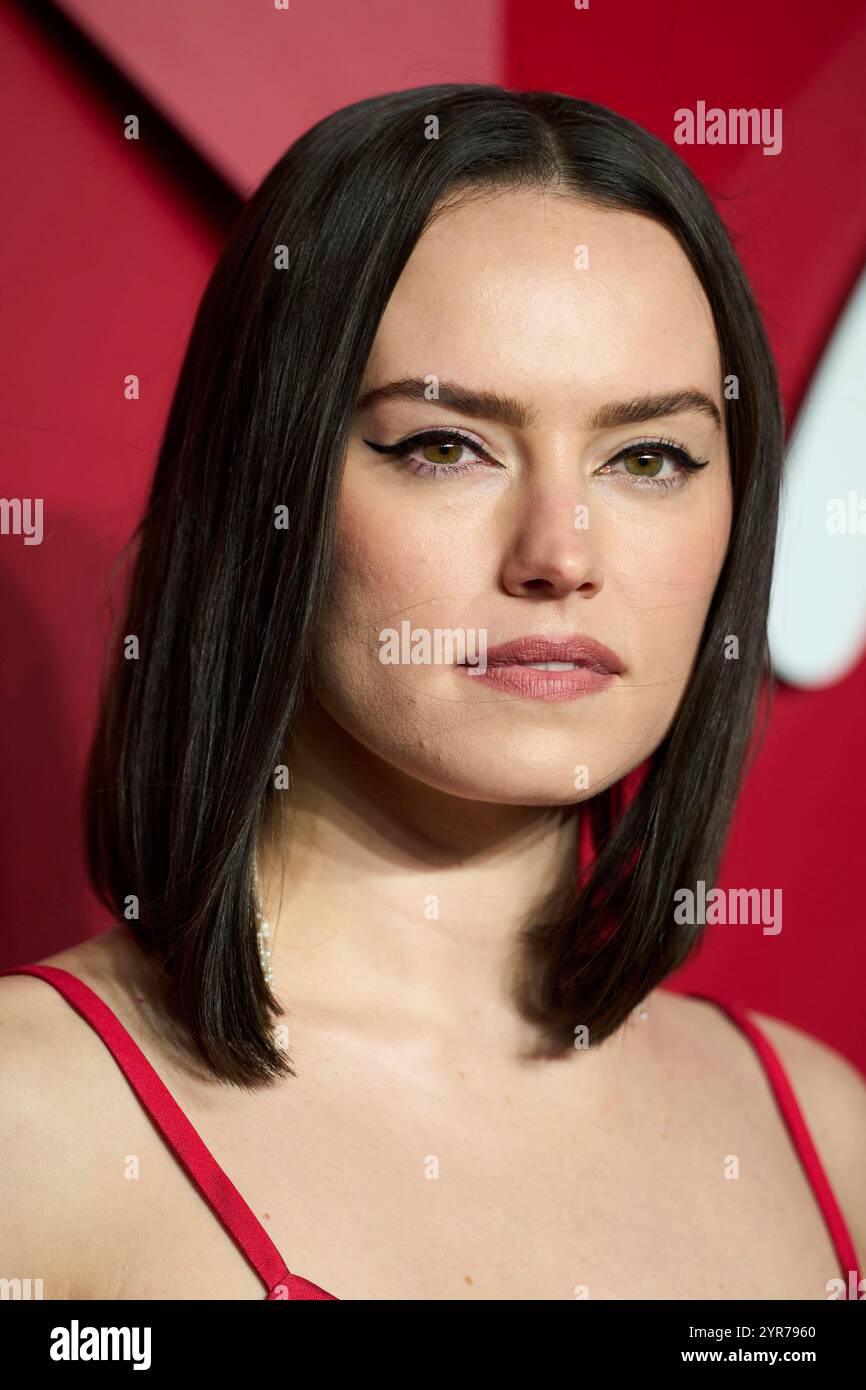 Daisy Ridley poses for photographers upon arrival at the The Fashion ...