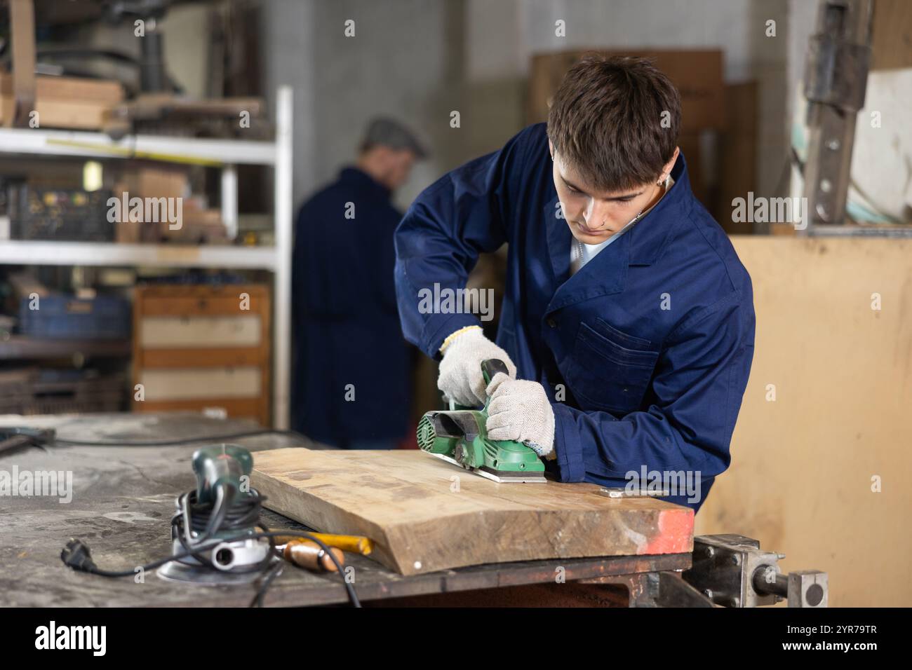 Carpenter working using electric planer hi-res stock photography and ...