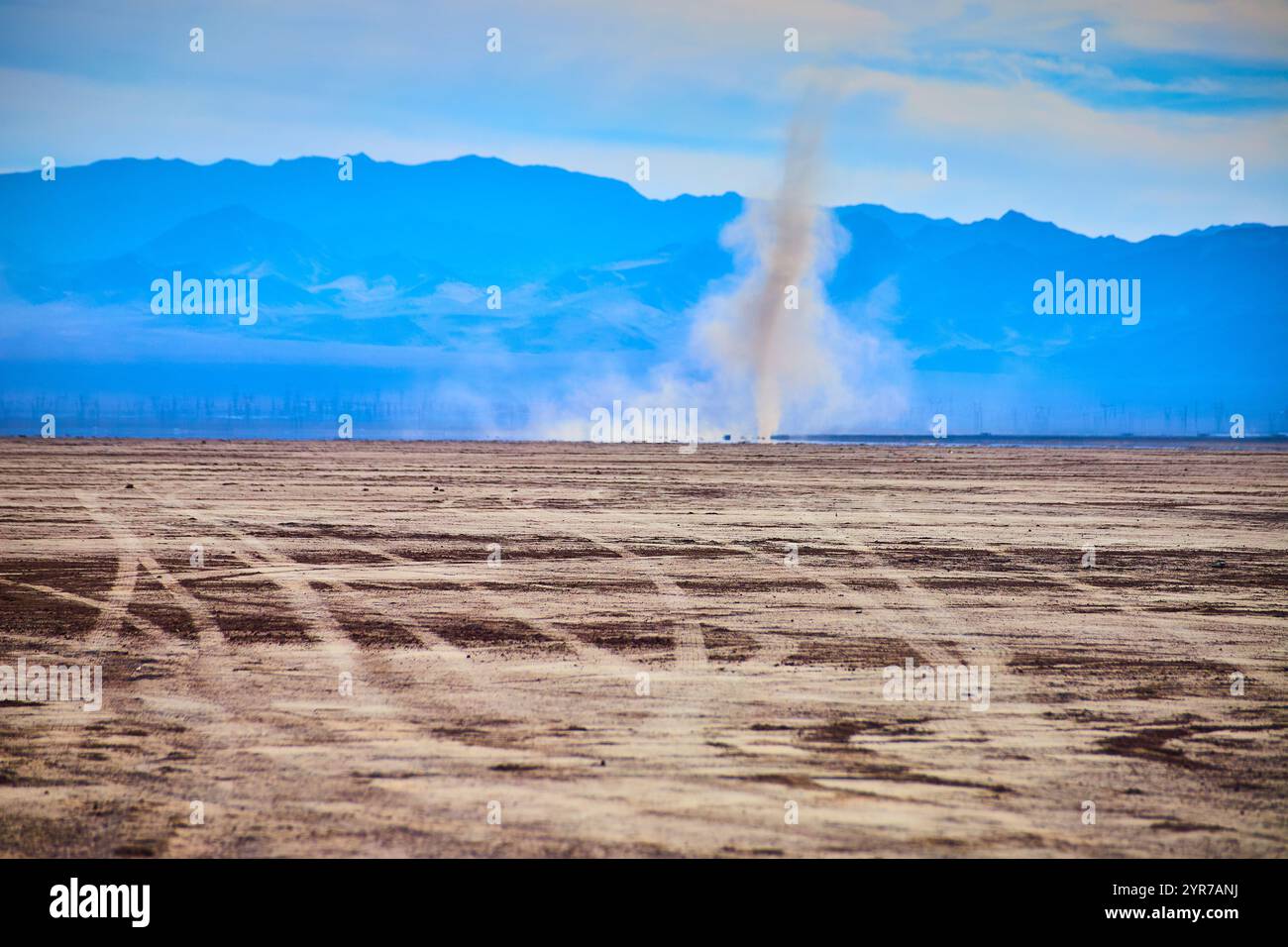 Dust Devil in Arid Desert with Mountain Backdrop Eye Level Perspective ...