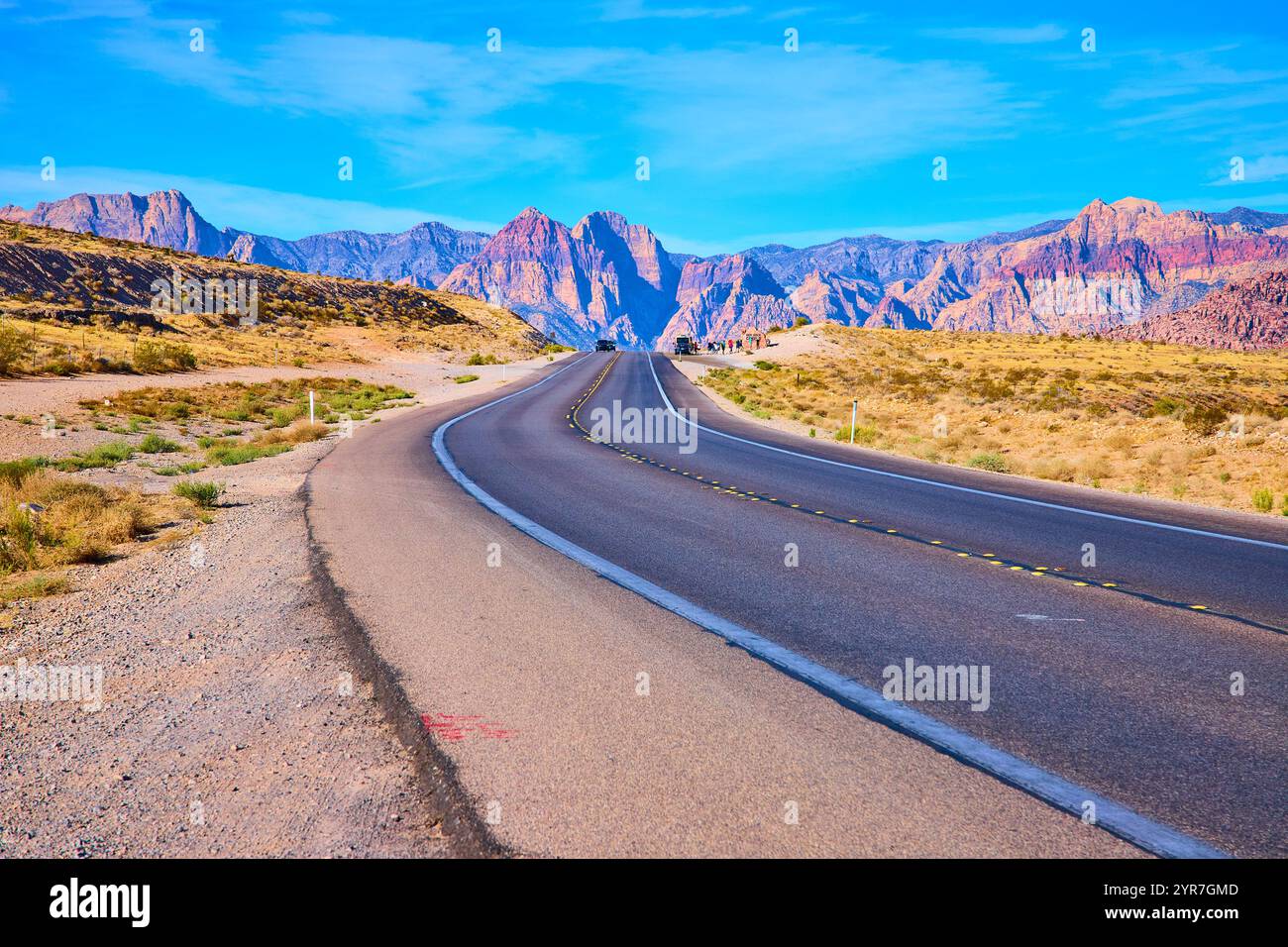 Desert Road to Red Rock Canyon with Mountain Backdrop and Open Sky ...