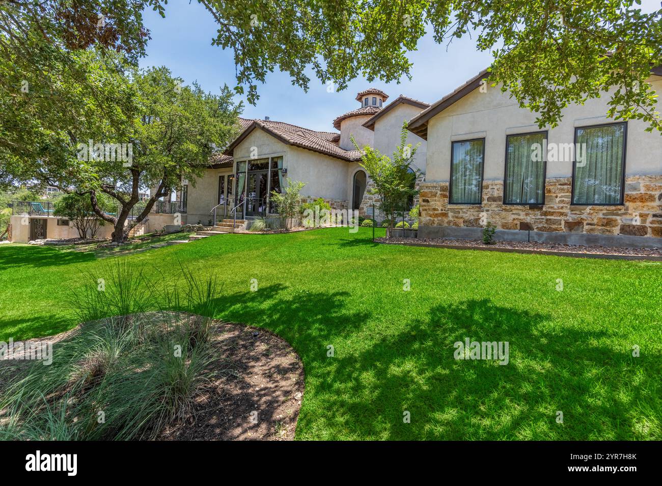 Beautiful residential home with lush greenery in a serene neighborhood ...