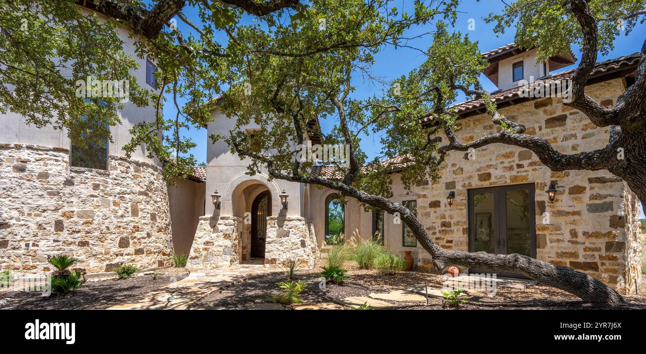 Charming rustic courtyard with lush greenery and stone architecture ...