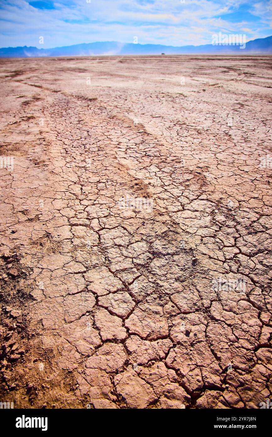 Cracked Desert Earth and Distant Mountains Ground Level View Stock ...