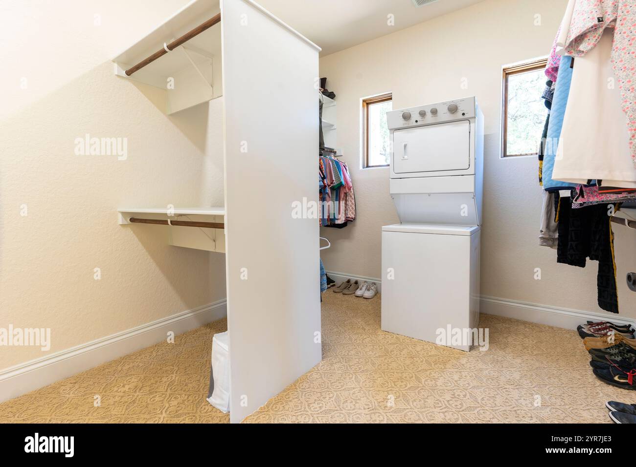 Organized laundry room with drying rack and washer dryer unit Stock ...