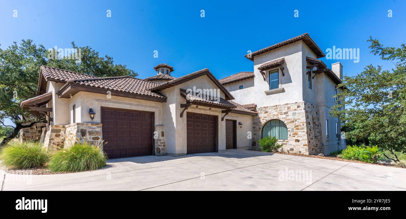 Beautiful modern home with stone accents and large driveway in sunny ...