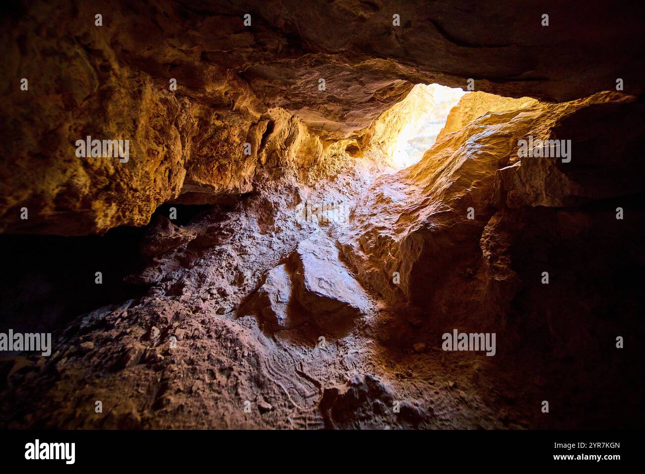 Cave entrance sunlit path hi-res stock photography and images - Alamy