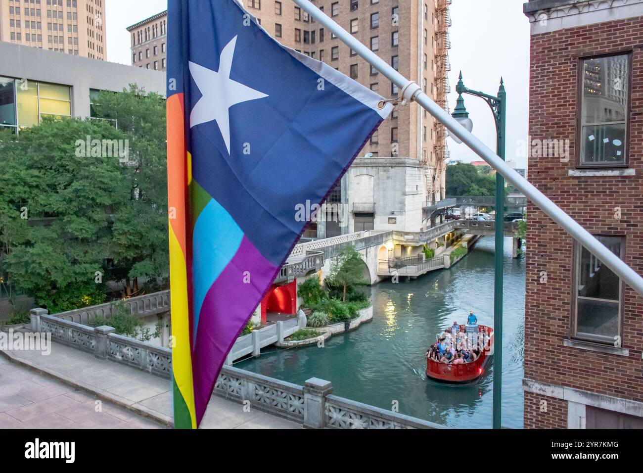 Texas Pride flag looking over the San Antonio riverwalk. Photo taken in ...