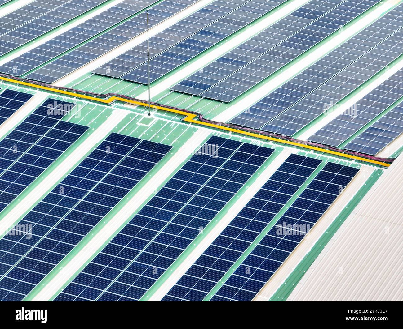 Solar energy for factory and warehouse building. Solar panels on roof ...