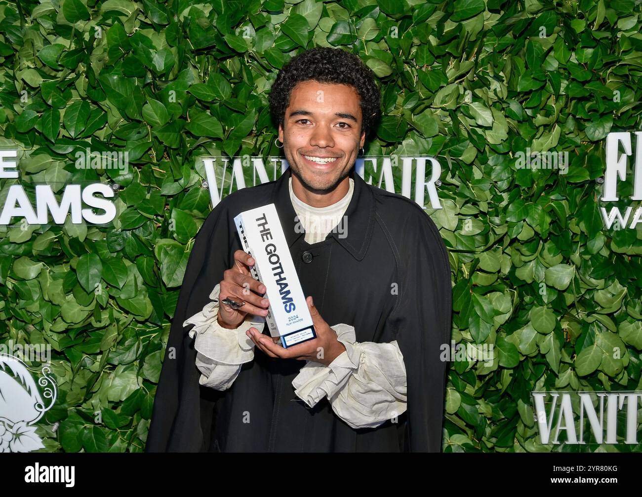 Actor Brandon Wilson poses with the breakthrough performer award for ...