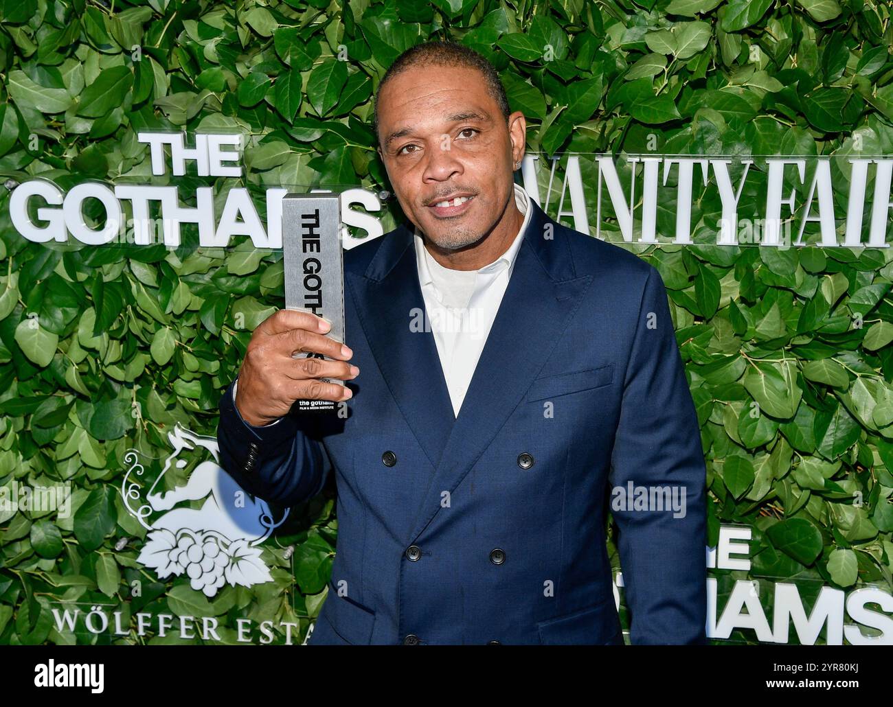 Clarence Maclin poses with the outstanding supporting performance award ...