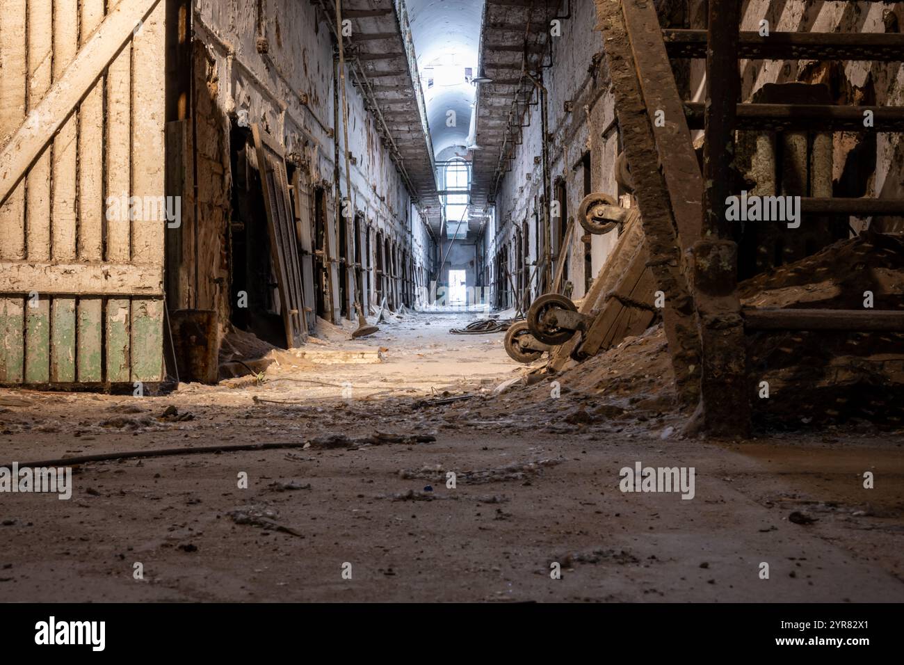 Ground level view of the dirty floor down a cell block at Eastern State ...