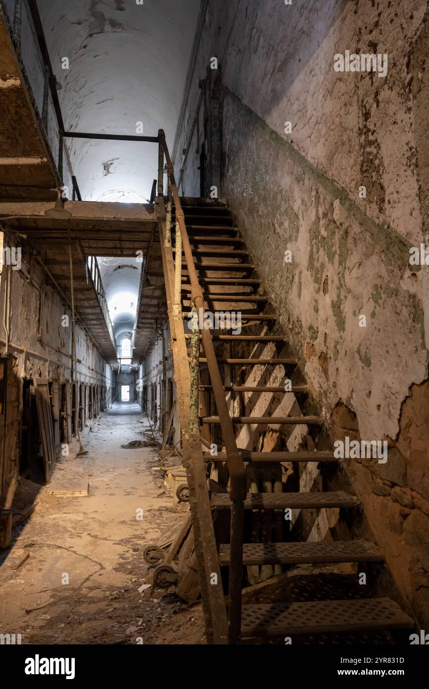 decrepit cell block and stairs leading to upper level at Eastern State ...