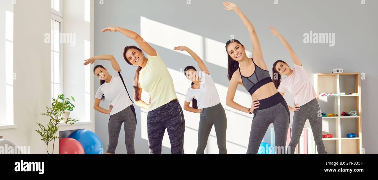 Fitness bend side leaning exercise, sporty girls, happy people doing ...