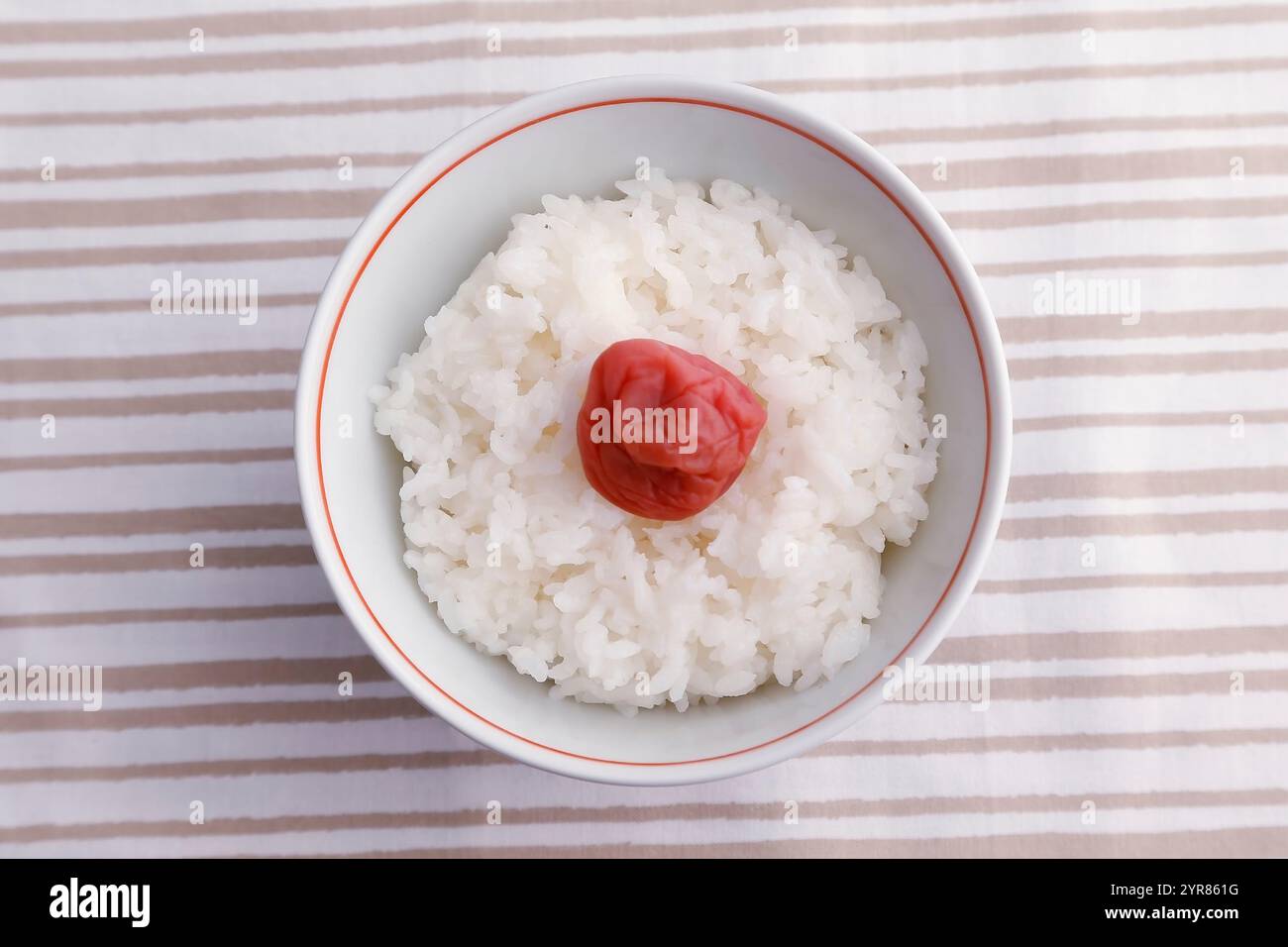 Rice and pickled plums seen from above Stock Photo - Alamy