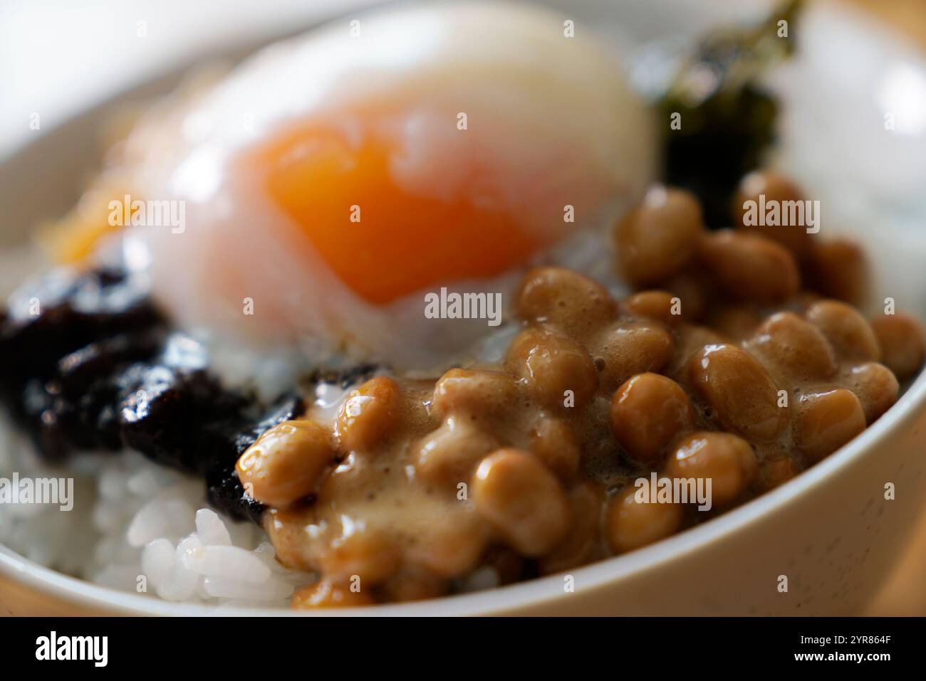 Onsen tamago, natto and nori rice Stock Photo - Alamy