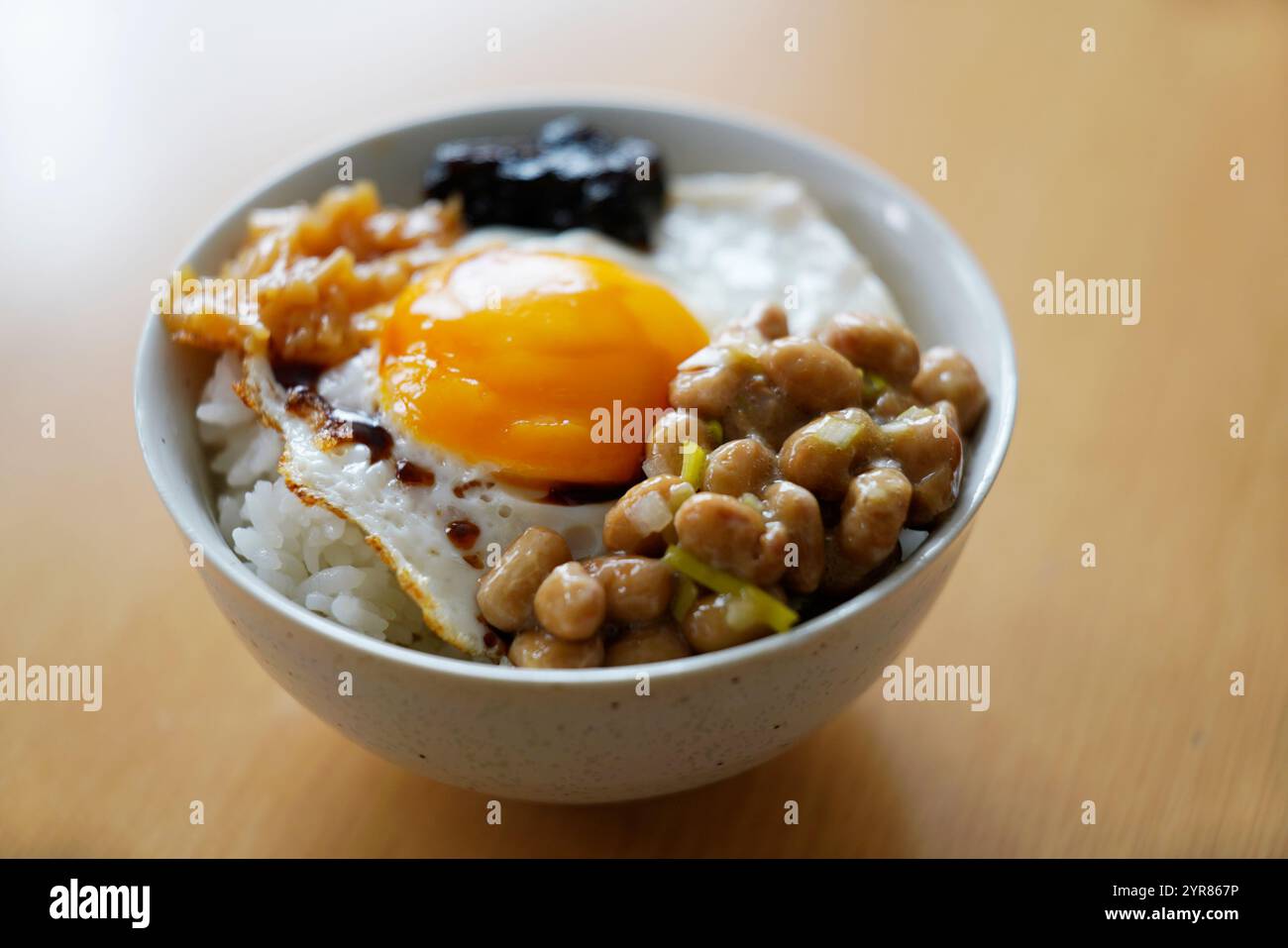 Rice with fried egg and natto Stock Photo - Alamy