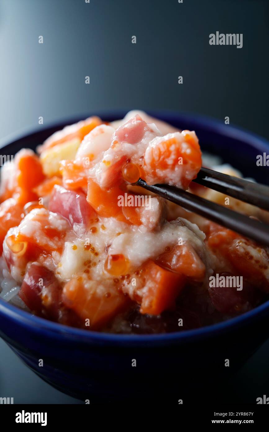Process photograph of Kaisen nagaimo being served with chopsticks Stock ...