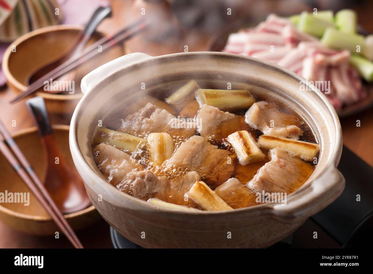 One-pot dish of pork belly with spring onion Stock Photo - Alamy