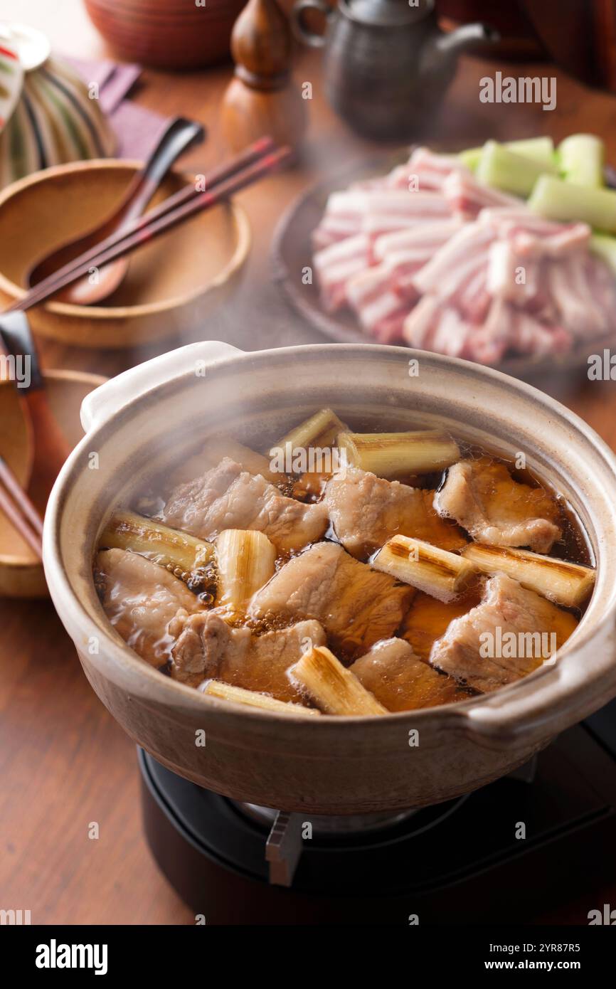 One-pot dish of pork belly with spring onion Stock Photo - Alamy