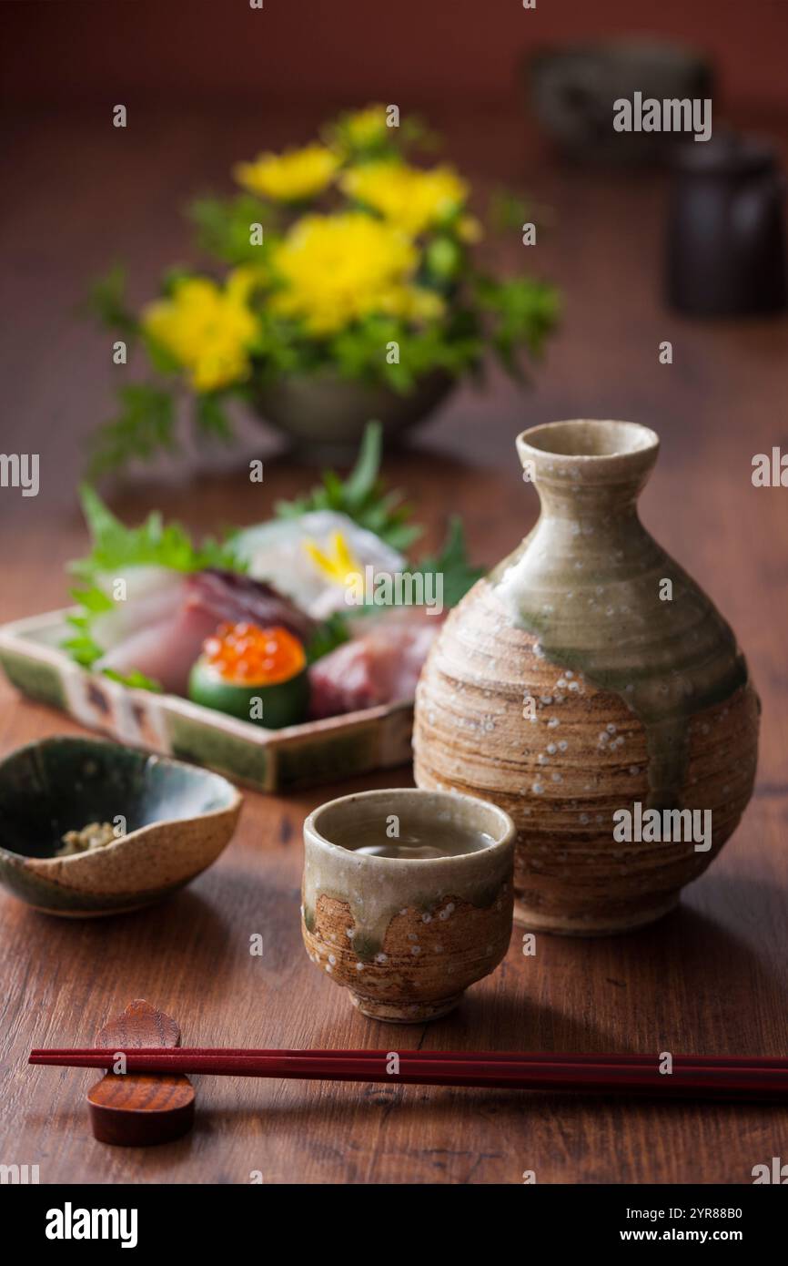 Sake and 4 sashimi Stock Photo - Alamy