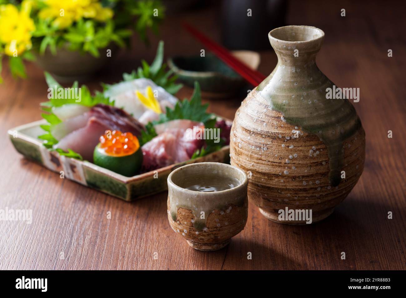 Sake and 4 sashimi Stock Photo - Alamy