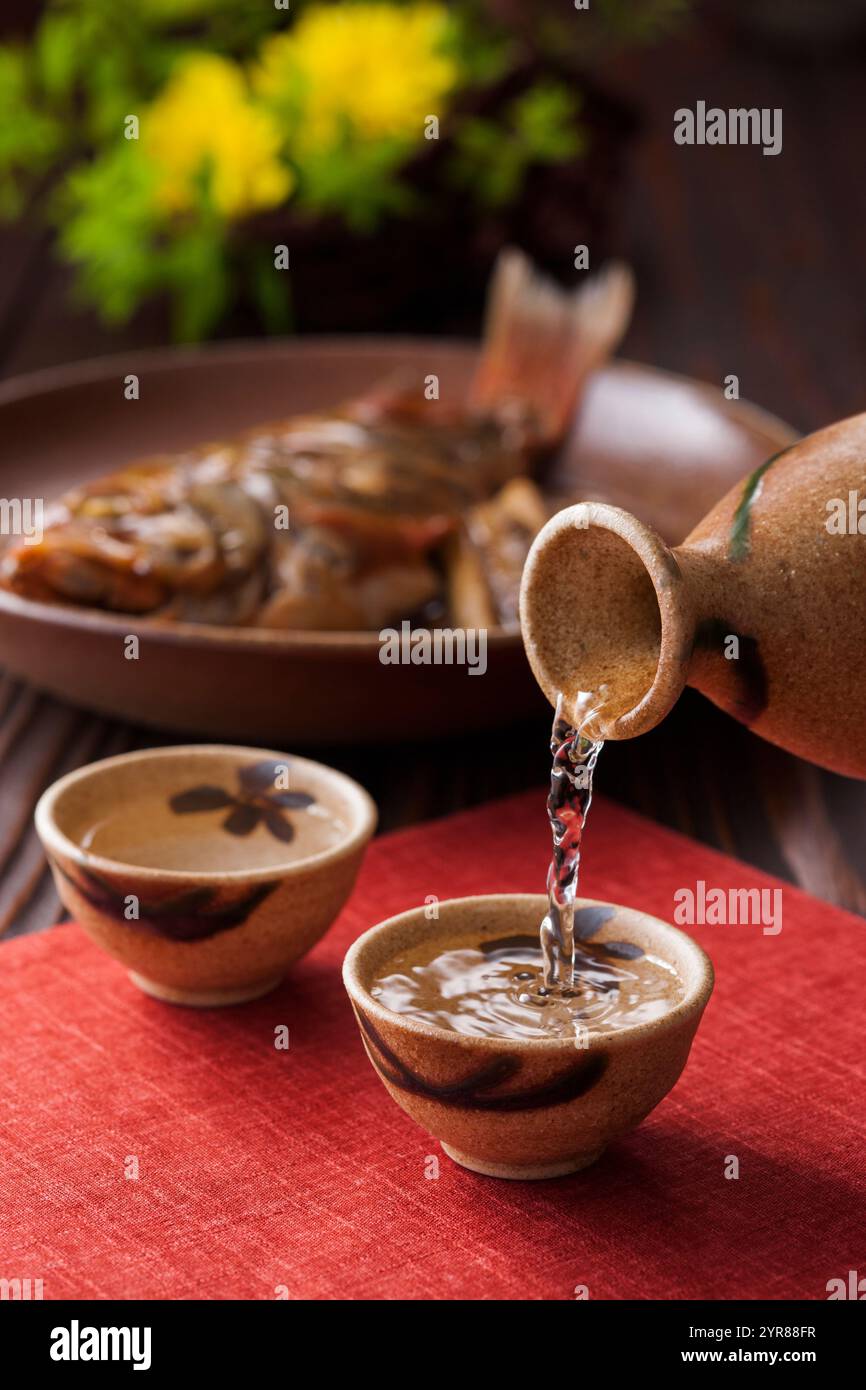 Sake and simmered Mebaru Stock Photo - Alamy
