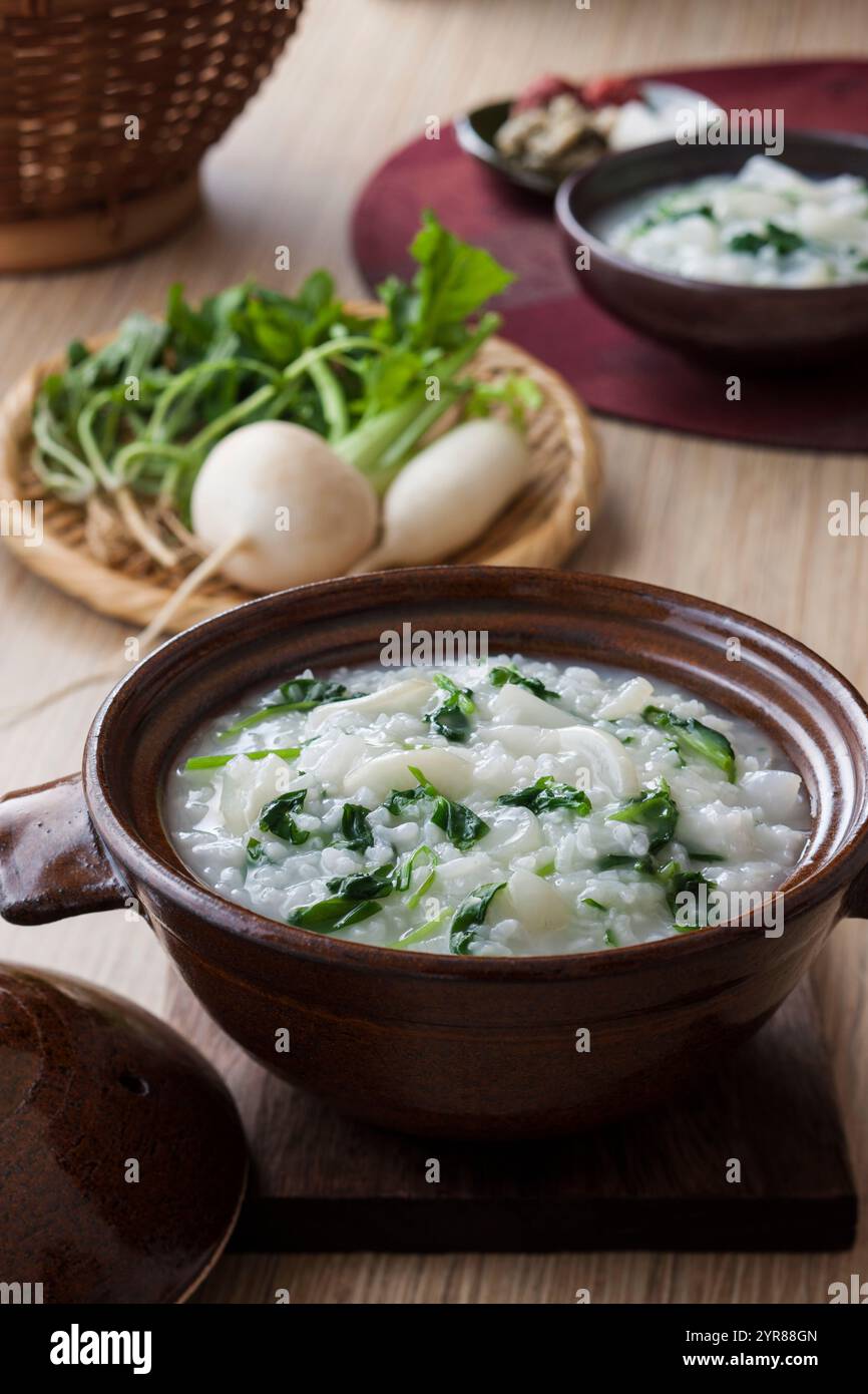 Spring rice gruel with seven herbs Stock Photo - Alamy