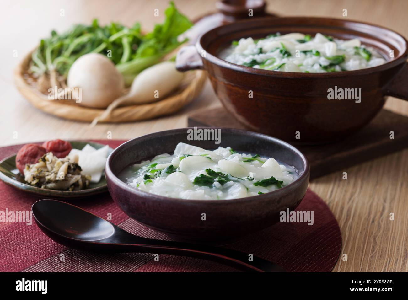 Spring rice gruel with seven herbs Stock Photo - Alamy