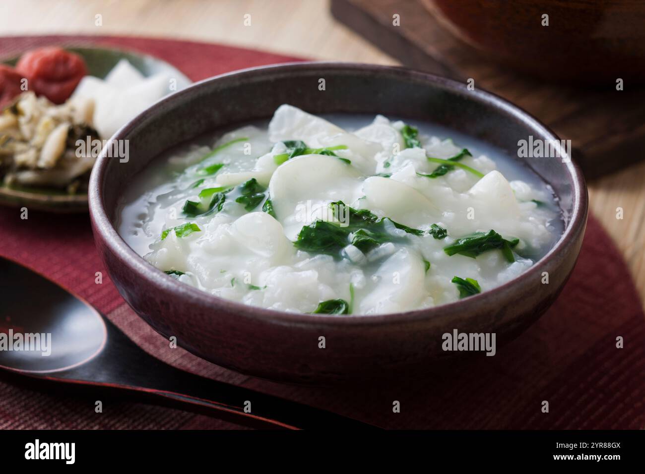 Spring rice gruel with seven herbs Stock Photo - Alamy