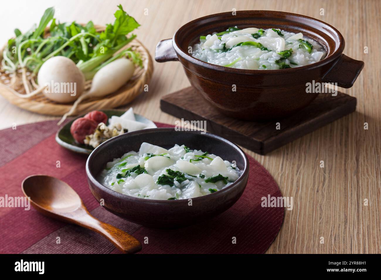 Spring rice gruel with seven herbs Stock Photo - Alamy
