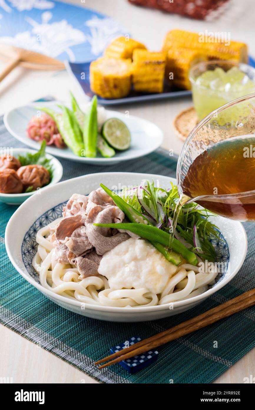 Chilled udon noodles with pork shabu and yam Stock Photo - Alamy
