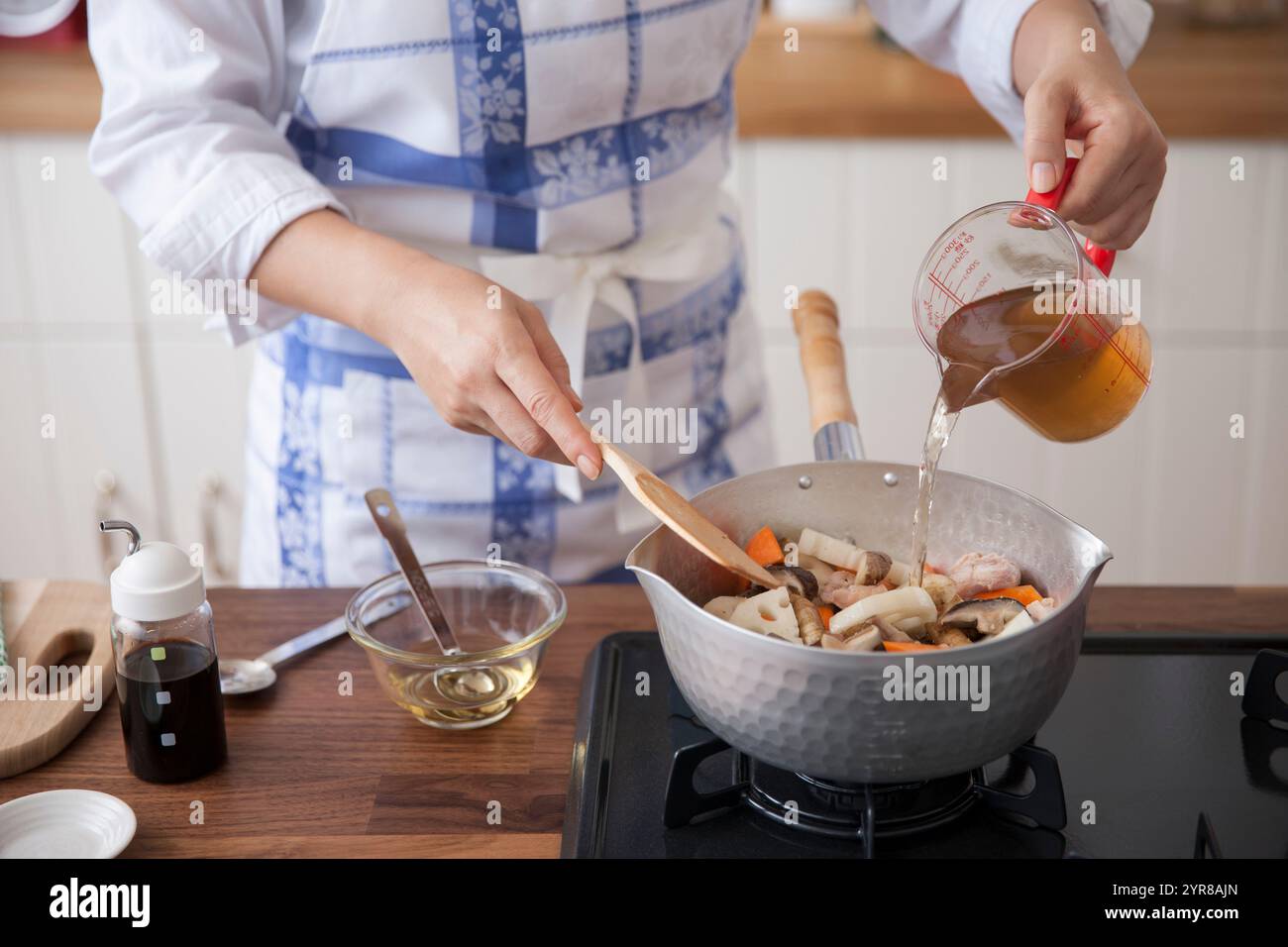 Woman frying vegetables mushrooms hi-res stock photography and images ...